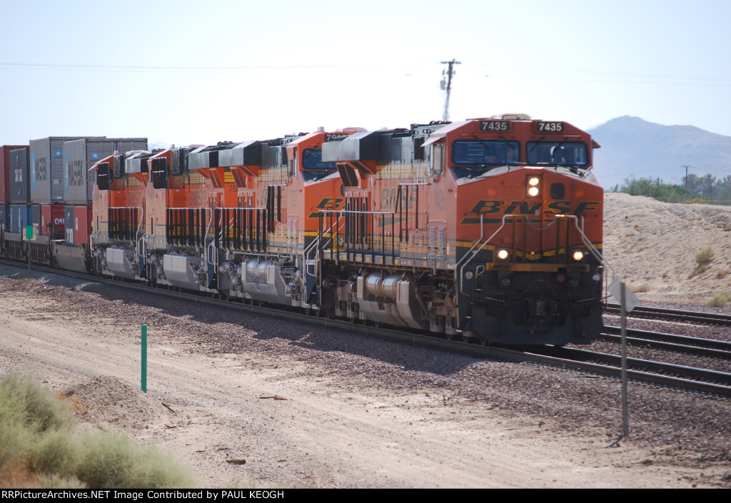 UntitledBNSF 7435 leads 3 Brand New C4's kastward (BNSF 7027, 7024, 7025) as they slow down for ...